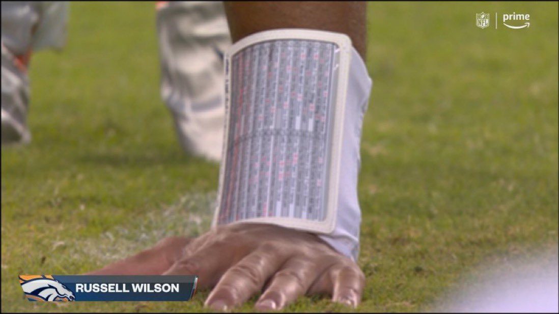 NFL Fans Are Wondering If Russell Wilson Can Even Read His Tiny Print ...
